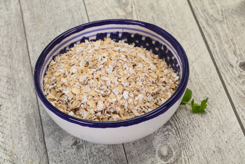 Raw oats in the bowl stock photo. Image of wheat, natural - 182368262