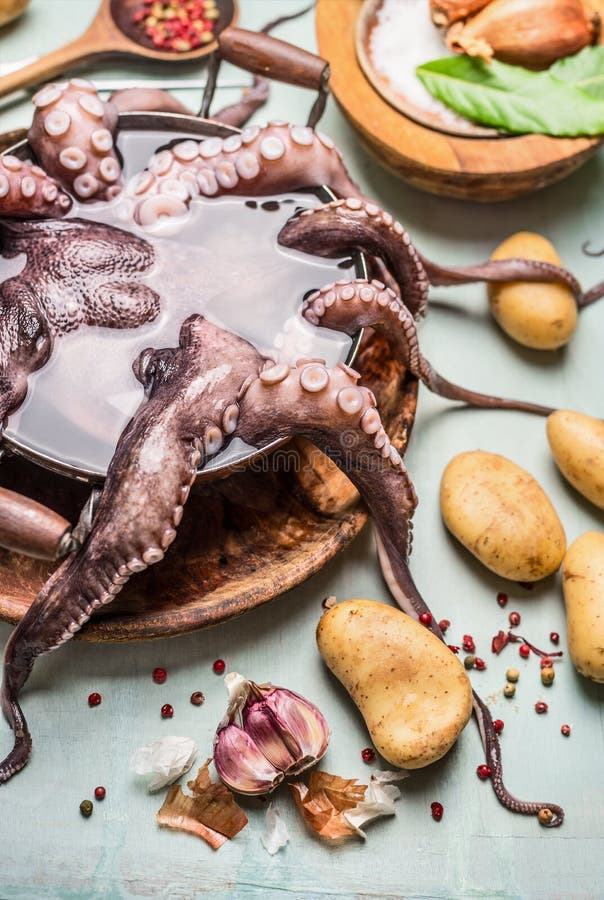 Raw Octopus in Pan with Water. Preparation on Rustic Wooden Table with ...