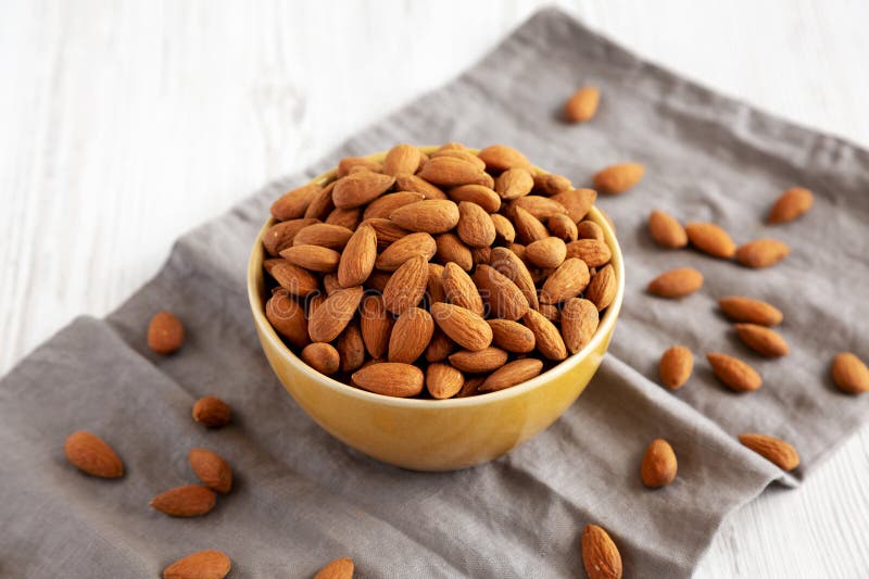 Raw Organic Almonds in a Bowl, Side View Stock Image - Image of fruit ...