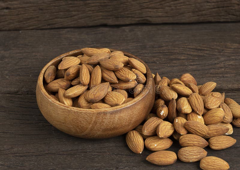 Raw Organic Almonds on Rustic Wood Table.Top View Stock Photo - Image ...