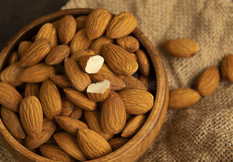 Raw Organic Almonds on Rustic Wood Table.Top View Stock Photo - Image ...