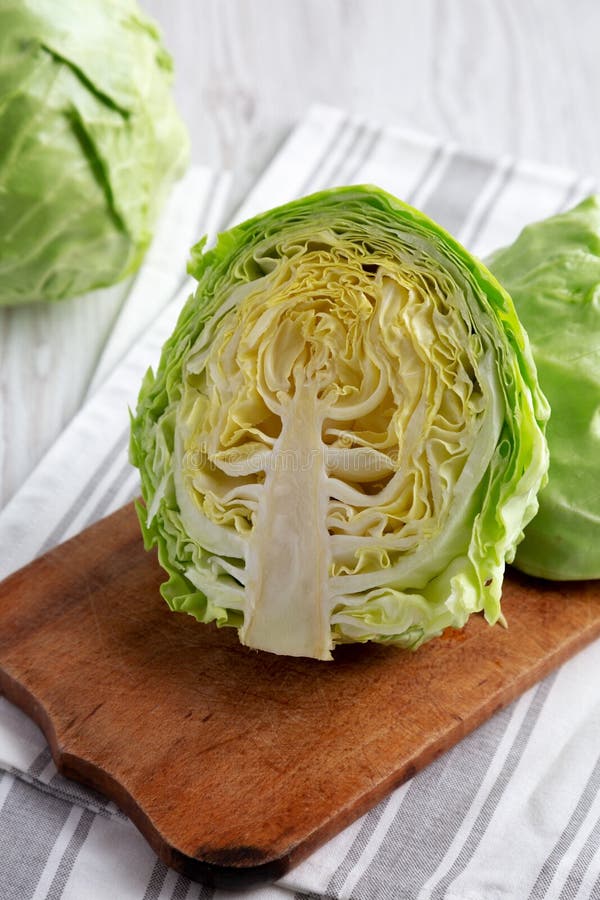 Raw Organic Cabbage on a Rustic Wooden Board, Side View Stock Image ...