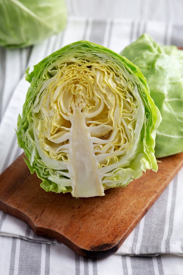 Raw Organic Cabbage on a Rustic Wooden Board, Side View. Close-up Stock ...