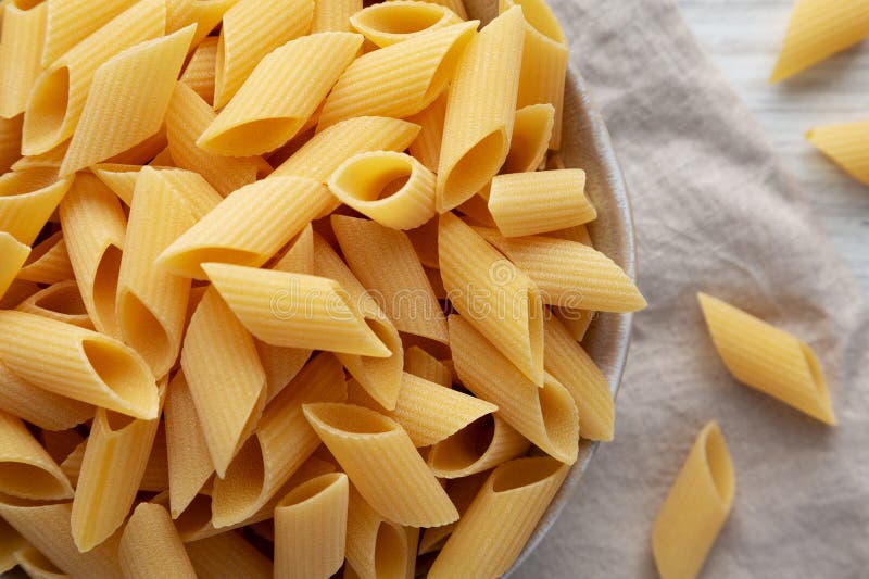 Raw Organic Dry Pennoni Pasta in a Bowl, Top View Stock Image - Image ...