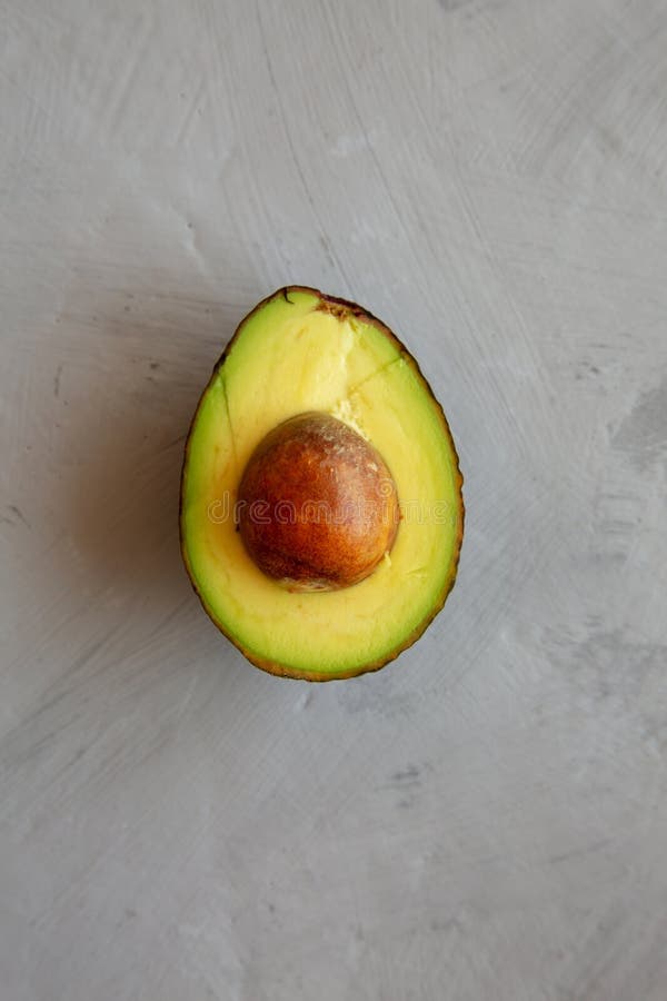 Raw Organic Hass Avocado on a Gray Surface, Top View. Flat Lay ...