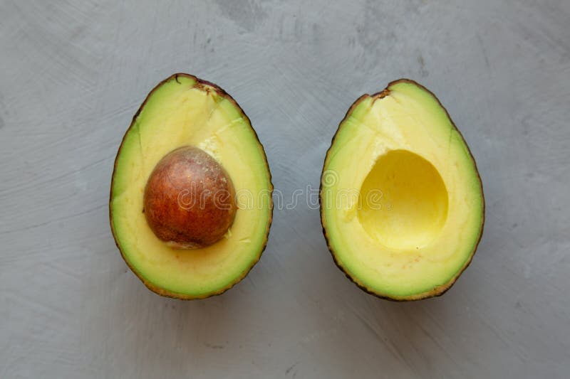 Raw Organic Hass Avocado on a Gray Surface, Top View. Flat Lay ...