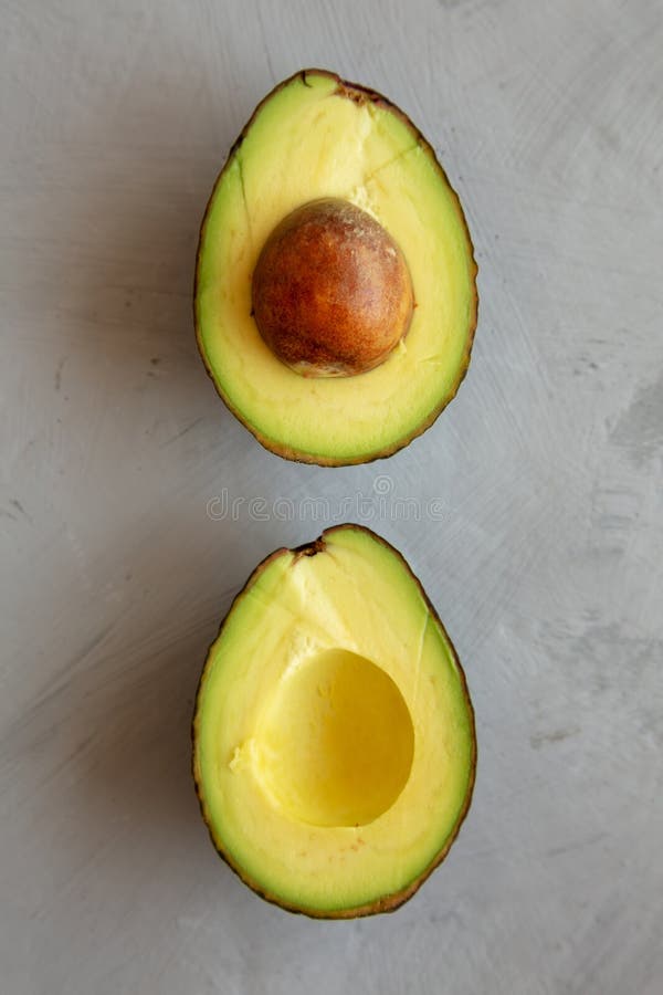 Raw Organic Hass Avocado on a Gray Surface, Top View. Flat Lay ...