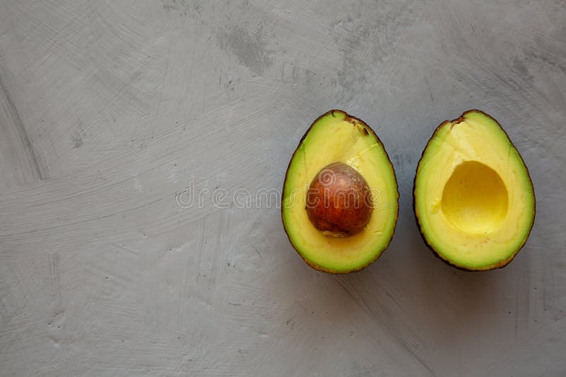 Raw Organic Hass Avocado on a Gray Surface, Top View. Flat Lay ...
