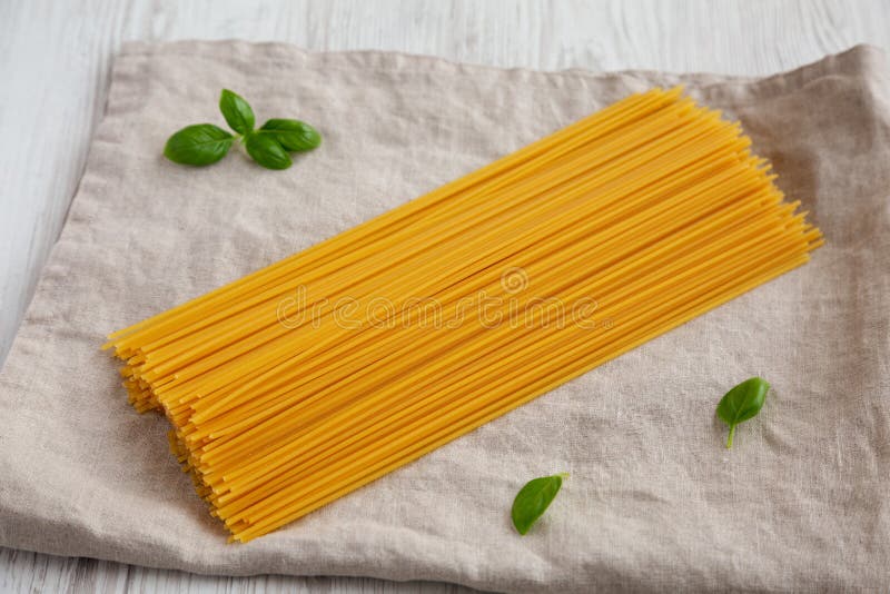 Raw Organic Spaghetti Pasta in a Bunch, Side View Stock Photo - Image ...