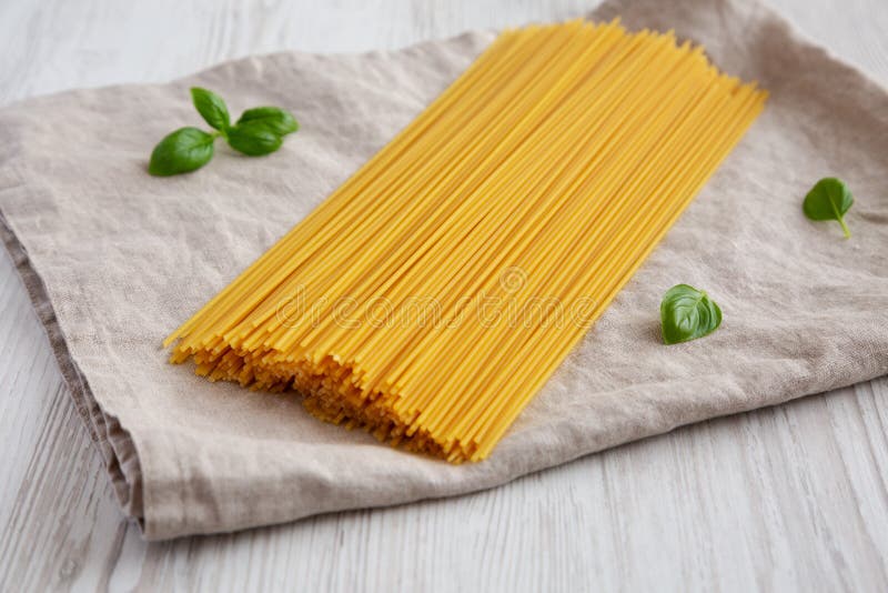 Raw Organic Spaghetti Pasta in a Bunch, Side View Stock Photo - Image ...