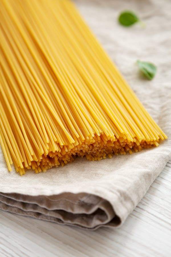 Raw Organic Spaghetti Pasta in a Bunch, Side View Stock Photo - Image ...