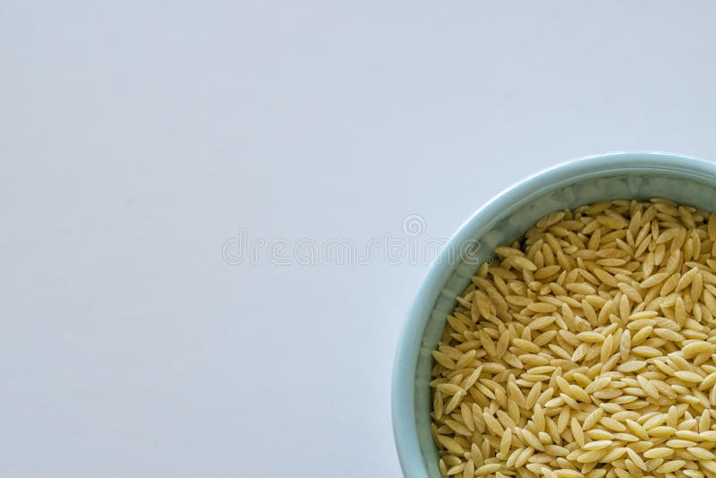 Raw Orzo in a blue bow stock photo. Image of bottom - 198073672