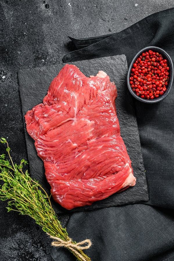 Raw Outside Skirt Steak, Marbled Meat. Black Background Stock Image ...