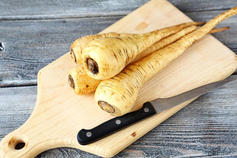 Raw Parsnip on a Cutting Board Stock Photo - Image of root, board: 46620874