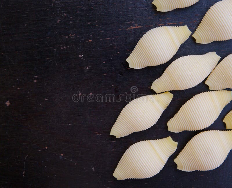 Raw Pasta on a Black Wooden Surface Stock Photo - Image of vegetarian ...