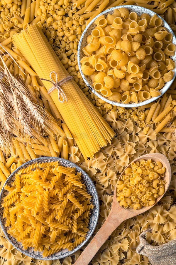 Raw Pasta of Different Types on the Table. Stock Photo - Image of bowls ...