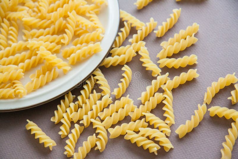 Raw pasta fusilli stock image. Image of noodles, carbohydrates - 72968453