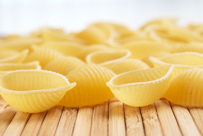 Raw pasta shells stock image. Image of close, food, italian - 20413533