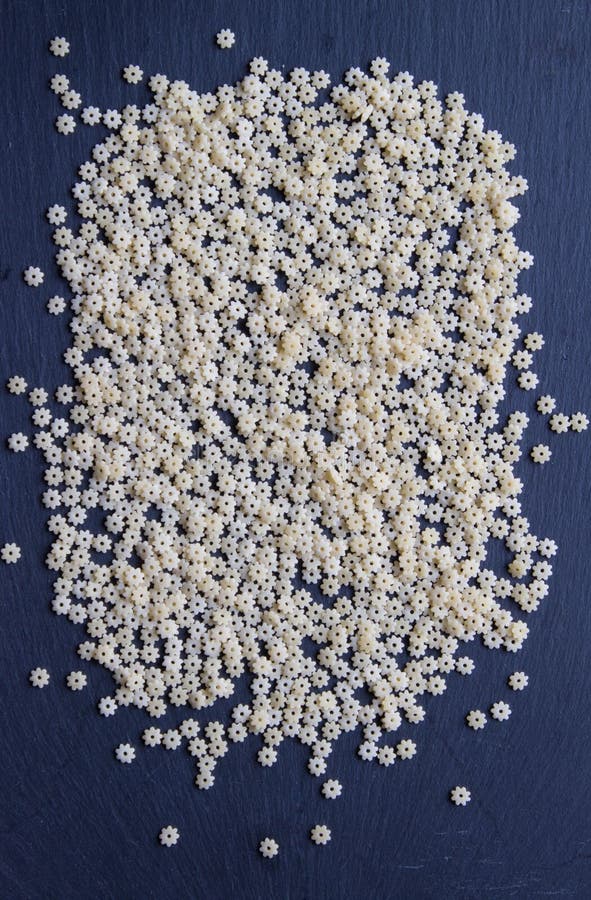 Raw Pasta Star Shape Isolated on Stone Background. Top View Stock Photo ...