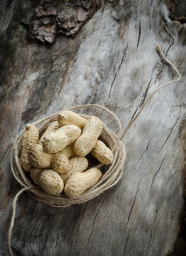 Raw Peanuts Scattered on Aged Wood Stock Image - Image of group, peanut ...