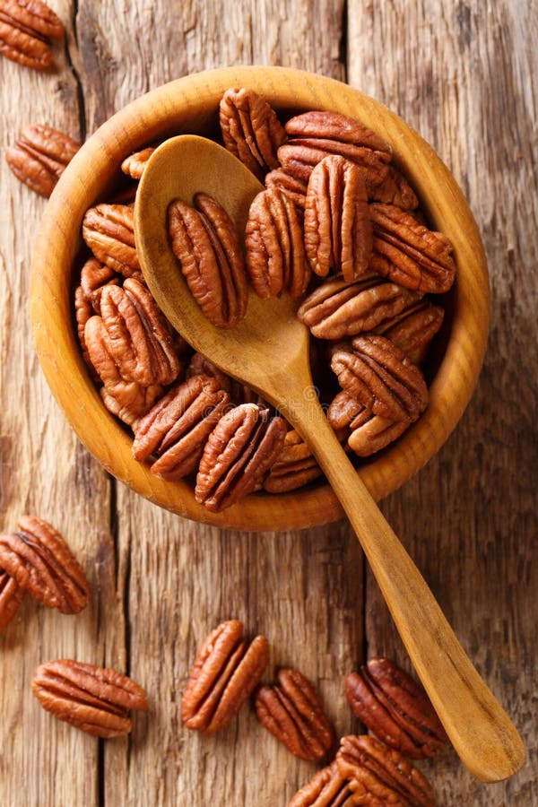 Raw Pecan Nuts in a Bowl Close-up. Vertical Top View Stock Photo ...