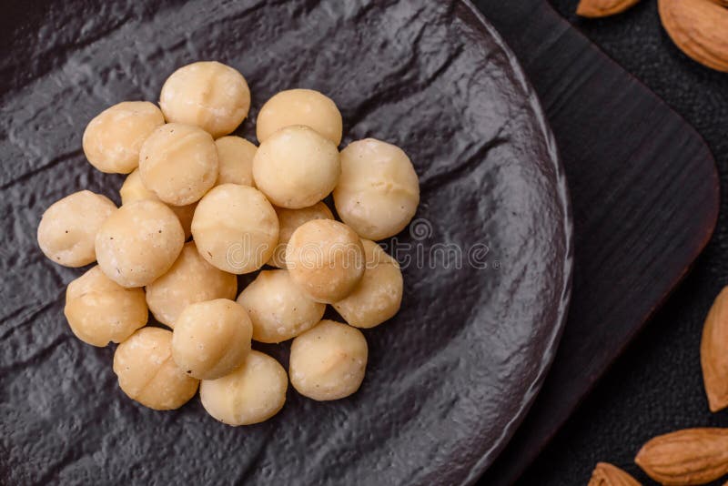 Raw Peeled Macadamia Nut in Ceramic Bowl Stock Photo - Image of source ...