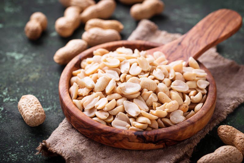 Raw peeled peanuts on bowl stock image. Image of table - 108413369