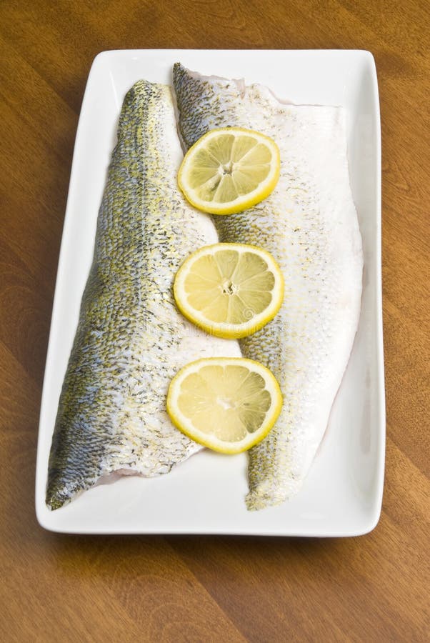 Raw Pickerel Fish Fillets with Sliced Lemon Stock Photo - Image of ...