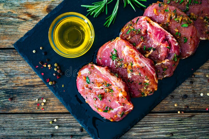 Raw Pickled Pork Cheeks on Stony Cutting Board on Wooden Table Stock ...