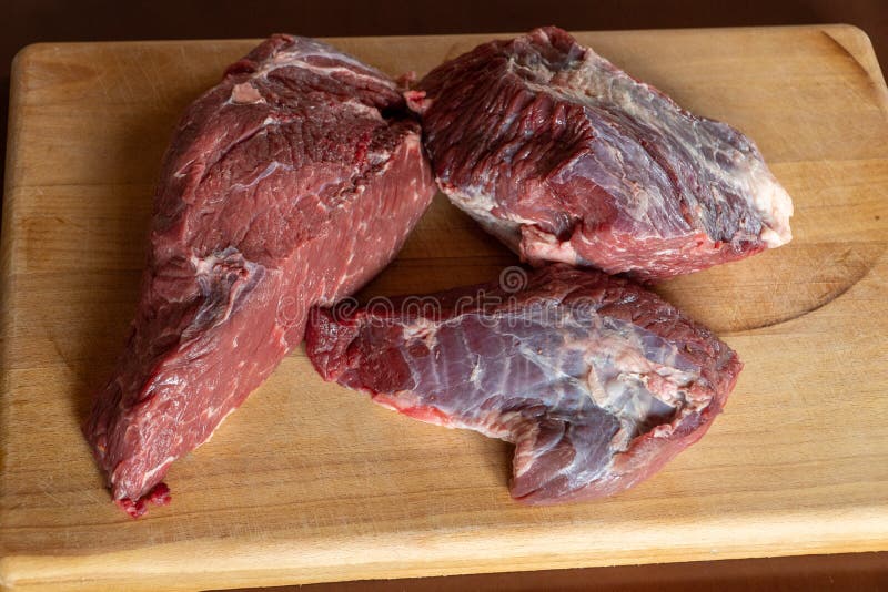 Raw Piece of Beef on Wooden Board.Clipping Path Stock Photo - Image of ...