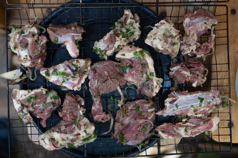 Raw Mutton Meat on a Grill with Onions Stock Photo - Image of fresh ...