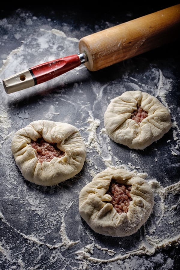 Raw Pies with Meat and Onions and Rolling Pin. the Process of ...