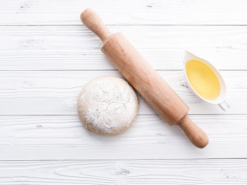 Raw Pizza Dough and Rolling Pin on Wooden Background Stock Image ... Raw Pizza Dough and Rolling Pin on Wooden Background Stock Image ...