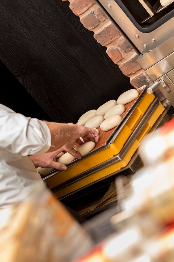 Raw plain buns in a bakery stock photo. Image of integral - 80331740