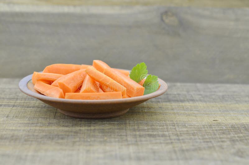 Raw Plate with Fresh Sticks Carrot on Wooden Rustic Stock Photo - Image ...