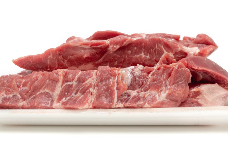 Raw Pork Meat Cuts in White Container Close Up Isolated on White ...