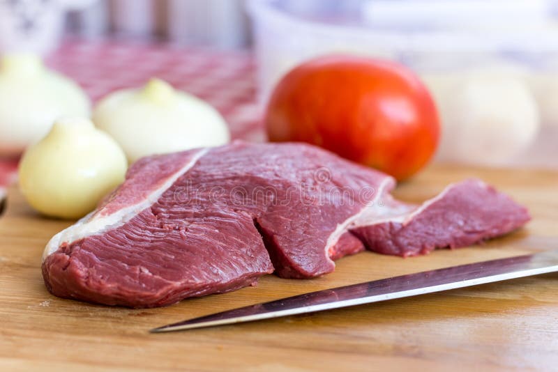 Raw Pork Meat with Vegetables and Kitchen Knife. Preparing Raw M Stock ...