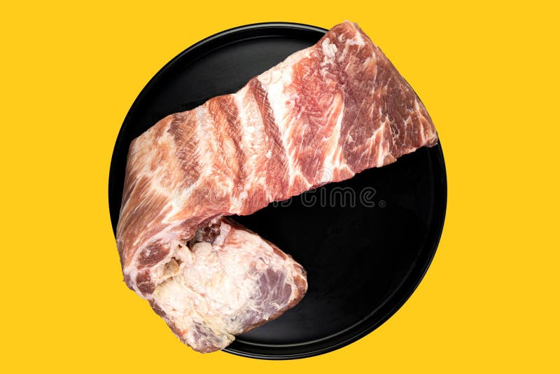 Raw Pork Ribs on a Black Plate on Yellow, Raw Meat, Top View Stock ...