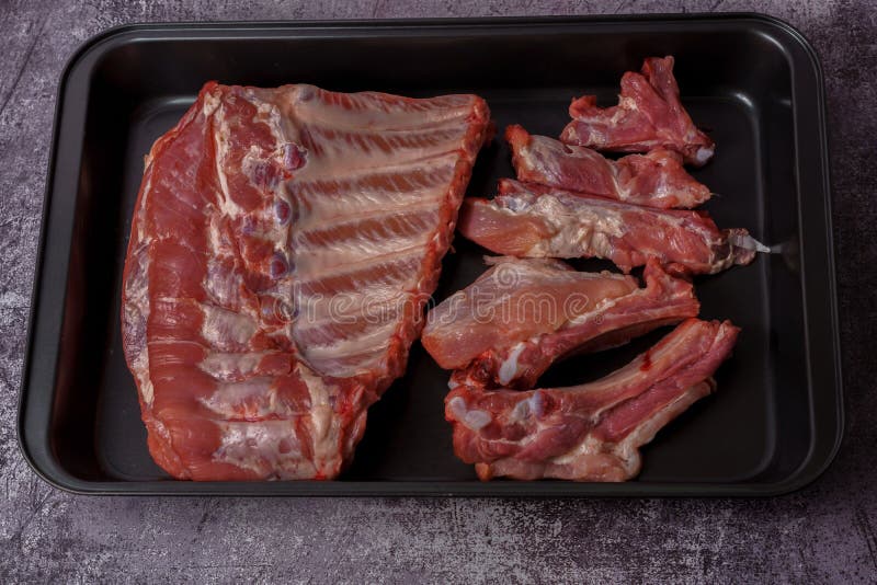 Raw Pork Ribs on a Black Platter Stock Photo - Image of food, roast ...