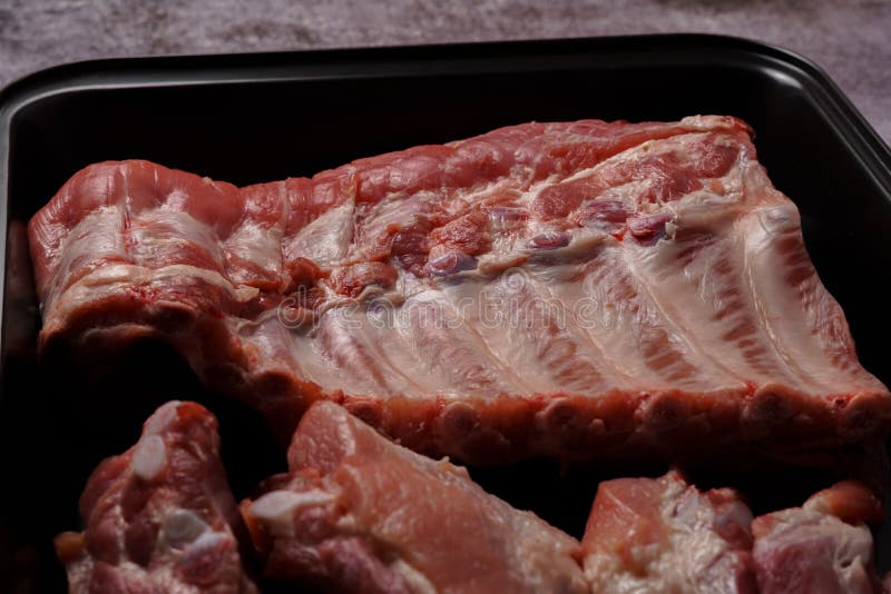 Raw Pork Ribs on a Black Platter Stock Image - Image of horizontal ...