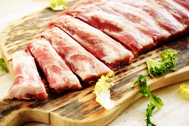Raw Pork Ribs on a Cutting Board Stock Photo - Image of white, closeup ...