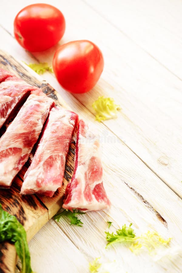 Raw Pork Ribs on a Cutting Board Stock Image - Image of slice, wood ...