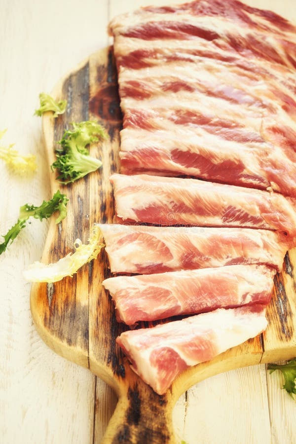 Raw Pork Ribs on a Cutting Board Stock Photo - Image of meaty, flat ...