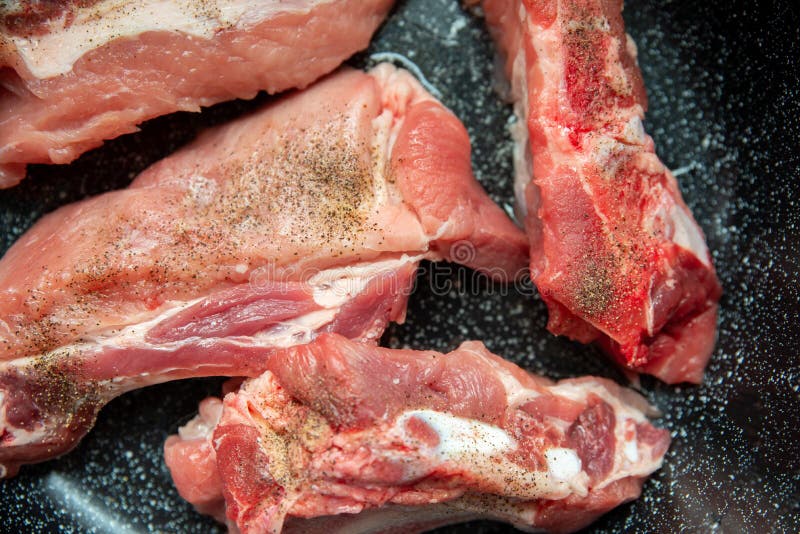 Raw Pork Ribs are Fried in Oil in a Frying Pan Stock Photo - Image of ...