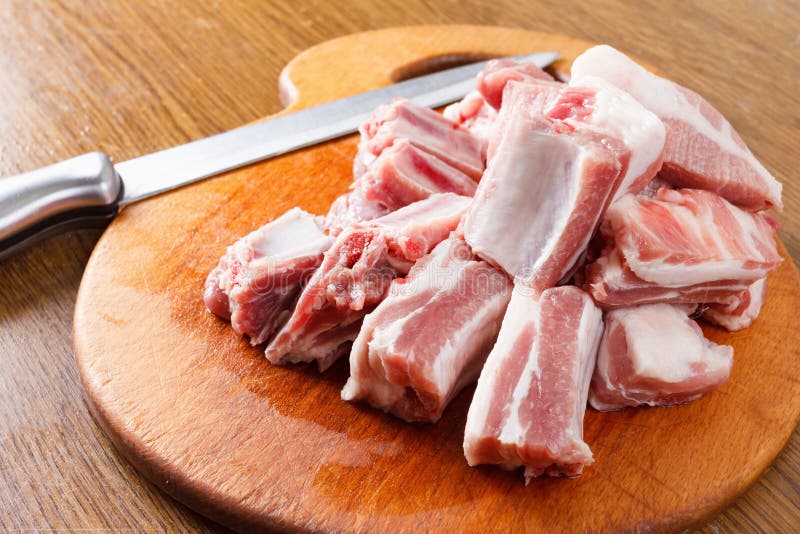Raw Pork Ribs and Knife on a Cutting Board Stock Photo - Image of roast ...
