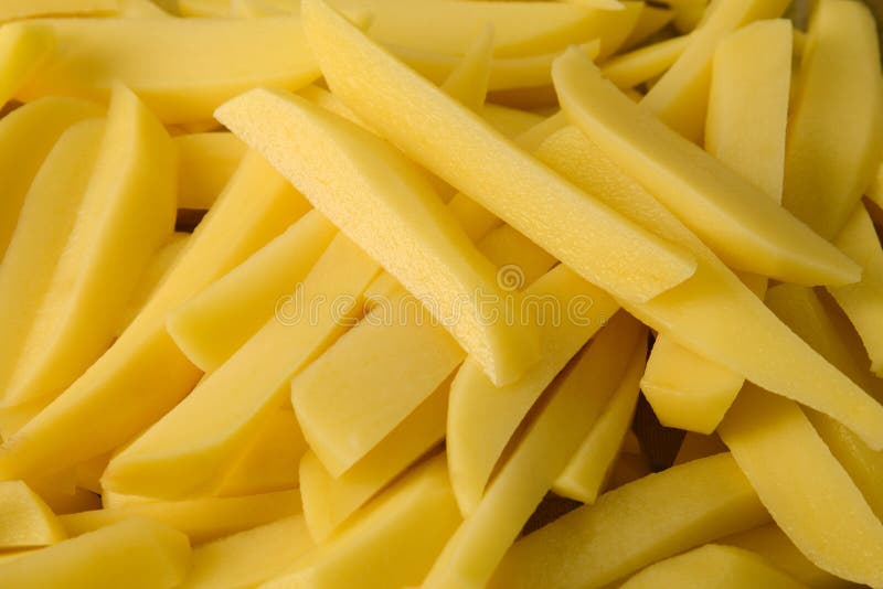 Raw potato cut into chips stock image. Image of yellow - 49604907