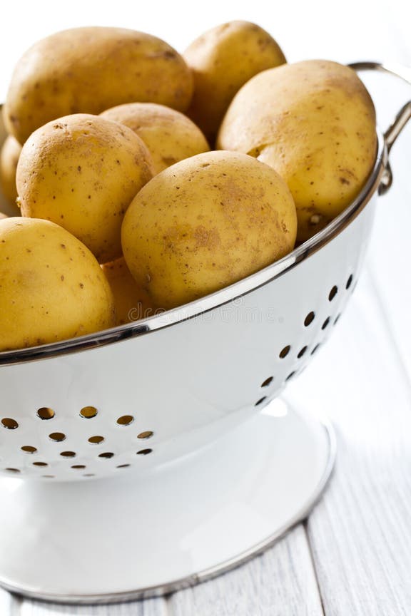 Raw potatoes in colander stock photo. Image of potato - 26478656