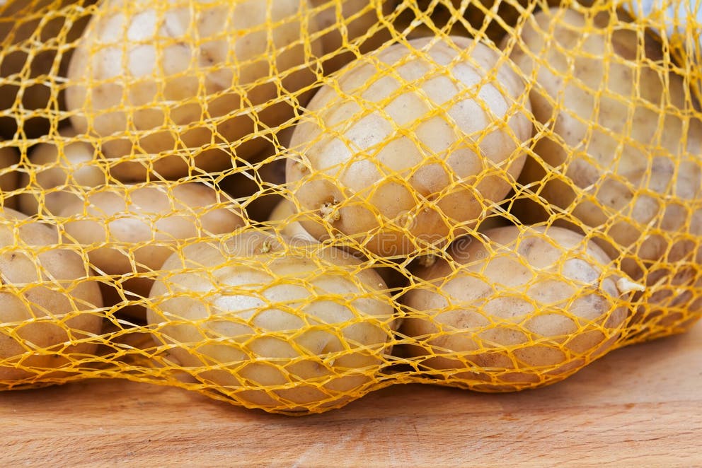 Raw potatoes in a sack stock image. Image of root, spuds - 26418613