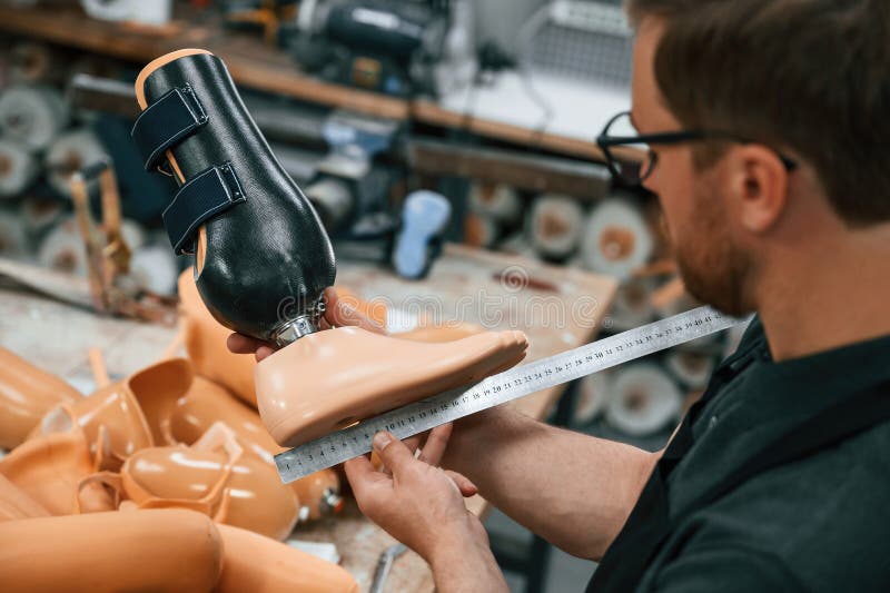 Raw Product for Prosthesis. Technician Working in Modern Laboratory ...