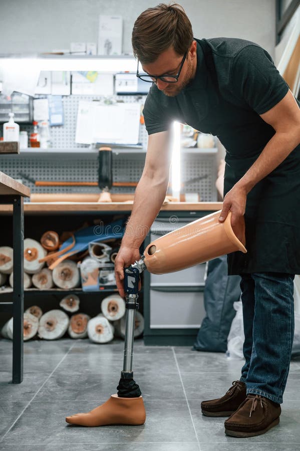 Raw Product for Prosthesis. Technician Working in Modern Laboratory ...